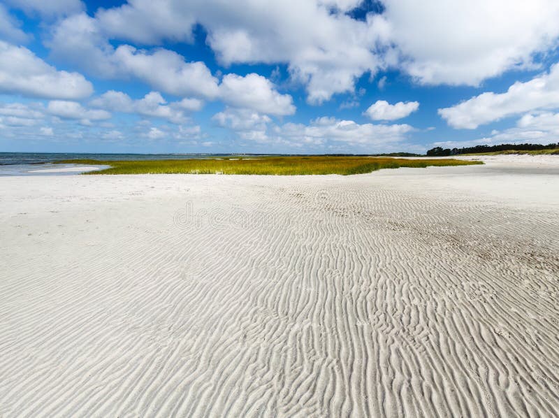 Wide Angle View of Sandbar with Sea Grass, Dunes, and Blue Sky and ...