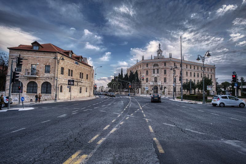 Historic City Intersection with Classic Architecture Under Dramatic Sky ...