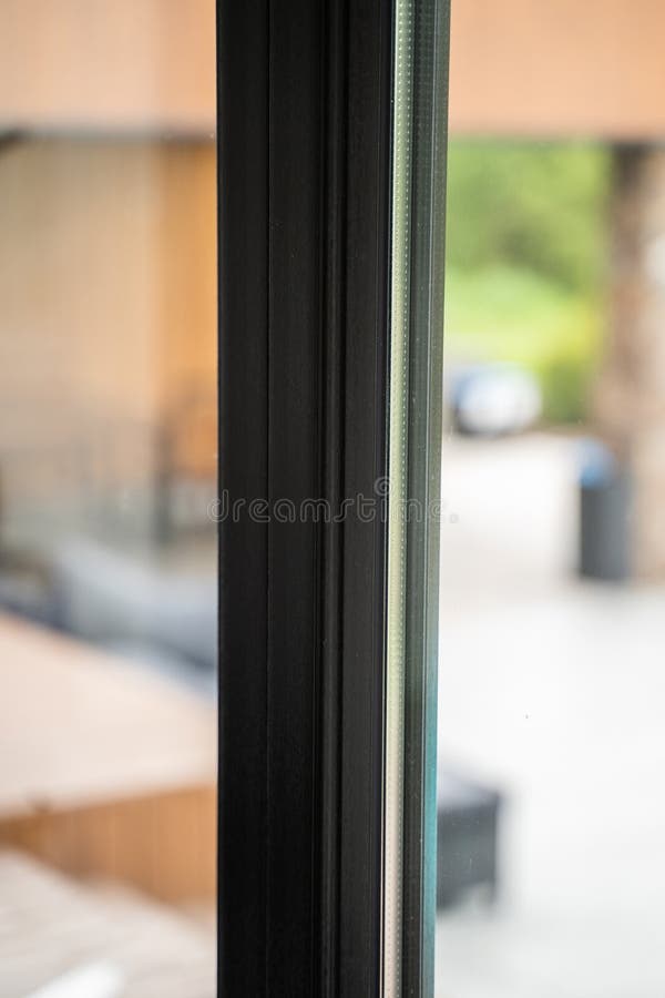 Wide Architectural Frame Shot of Black Aluminum Windows with Layered ...
