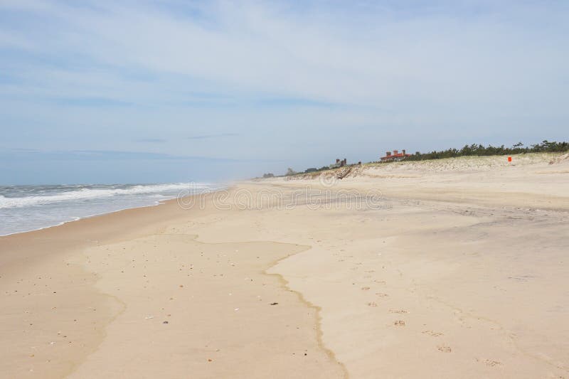 Wide Beach Looking Right with the Waves of the Ocean and Dunes in the ...