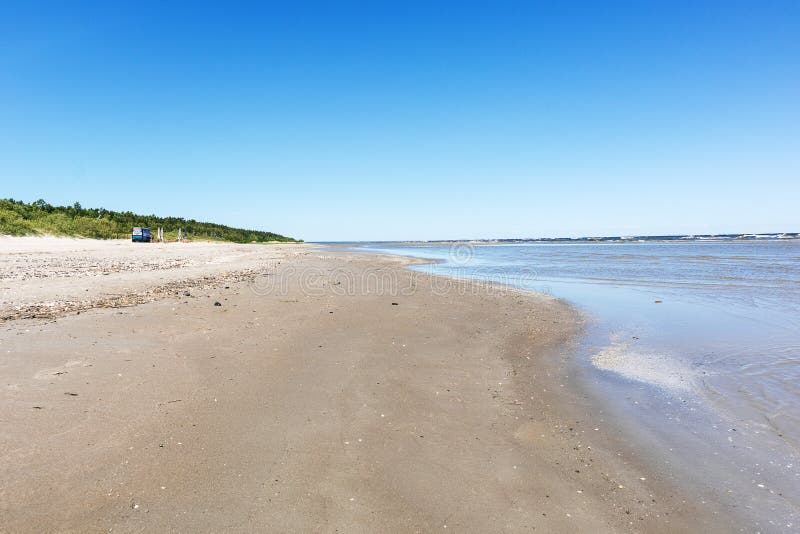 .a Wide Beach with Sand and a Seashore Where the Water Slowly Meets the ...