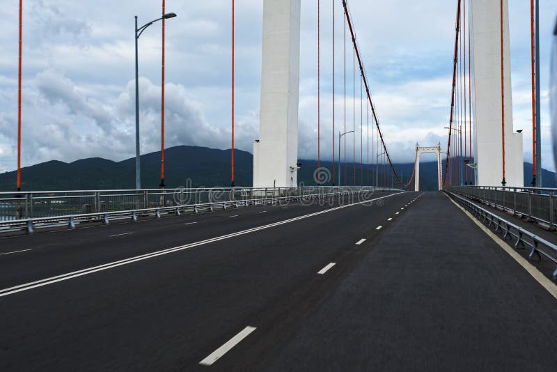 Wide Bridge Road beside Hills Stock Photo - Image of hills, journey ...