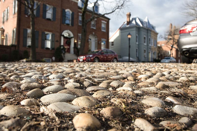 Wide Cobblestone Street with Houses on the Background Stock Image ...