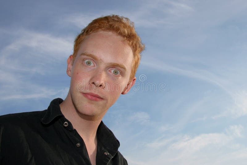 Wide-eyed Young Man Against Blue Sky Stock Image - Image of vibrant ...