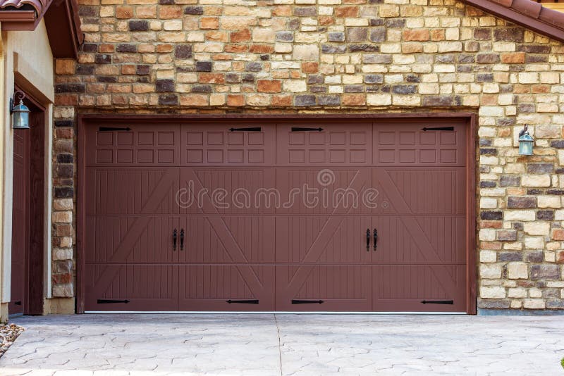 Wide Garage Doors stock photo. Image of property, pavement - 43061010