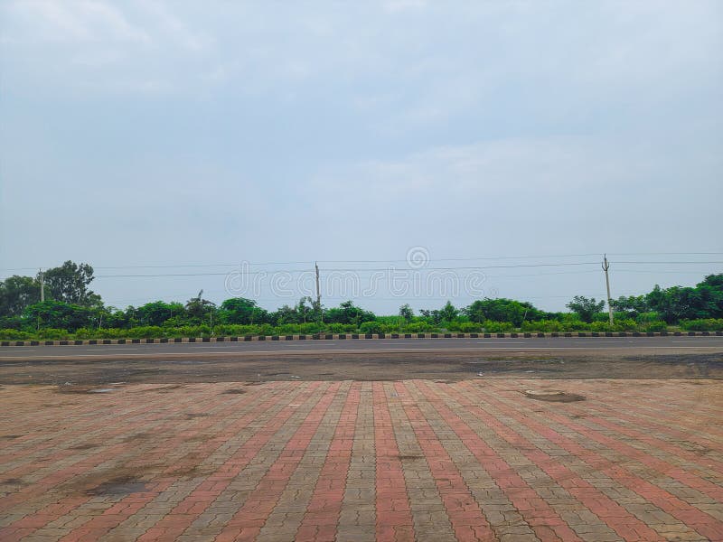 Wide Highway with Interlocking Pavement Foreground, Bordered by ...