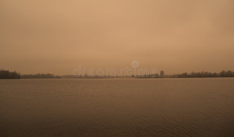 A Wide Landscape of a Dark Gray Lake and Forest Stock Image - Image of ...