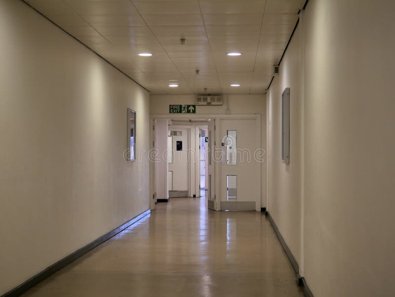 White Painted Corridor with Fire Doors Stock Image - Image of flooring ...