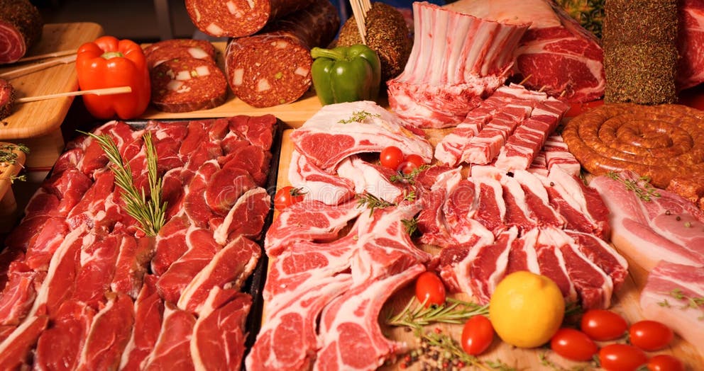 Wide Range of Processed and Raw Meat Goods on the Table. Stock Photo ...