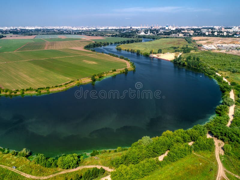 Wide River Flowing between Fields Stock Photo - Image of tranquil ...