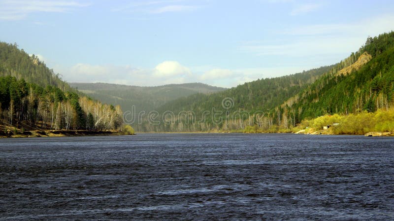 Wide River Runs Slowly Towards the Wooded Mountains Stock Image - Image ...