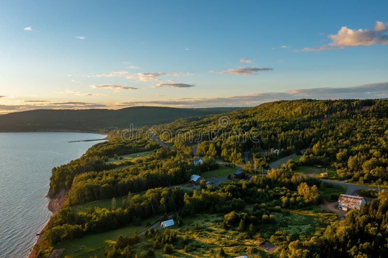 Wide River in Wooded Valley at Sunset in Quebec, Canada. Mountains on ...