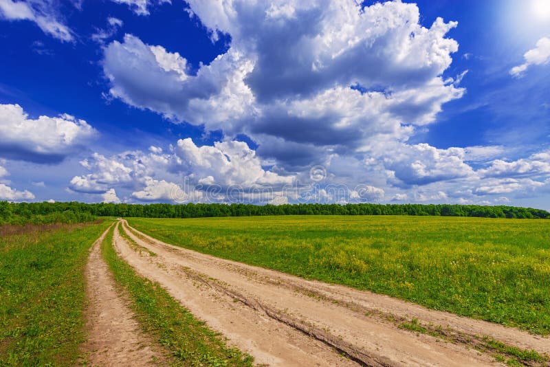 Wide road by the field. stock photo. Image of europe - 76711772