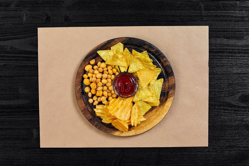 Wide Selection of Snacks for Beer with Different Sauces on Parchment ...