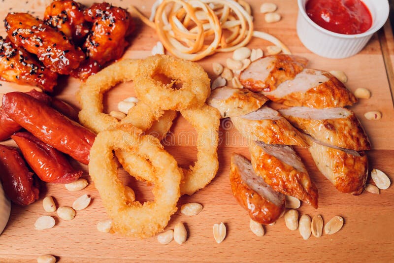 Wide Selection of Snacks for Beer with Different Sauces on Parchment ...