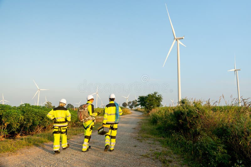 Wide Shot and Back of Group of Wind Turbine or Windmill Workers or ...