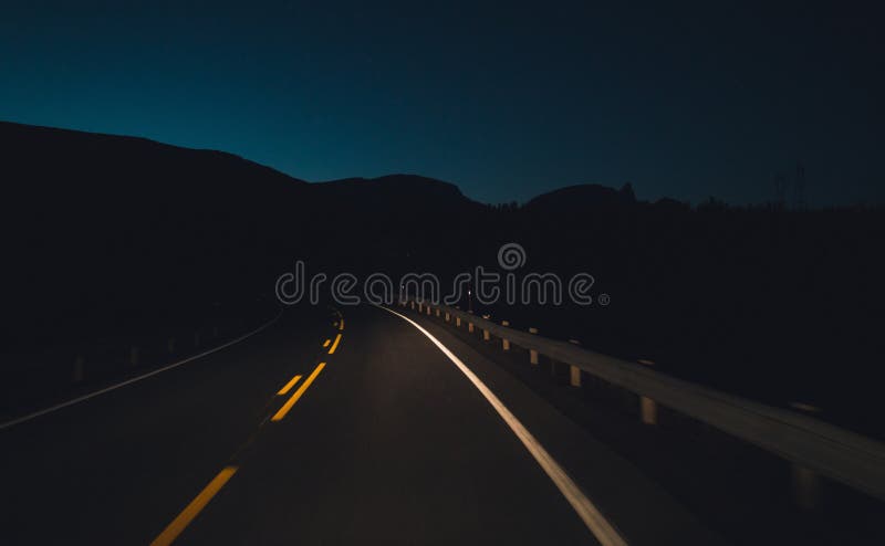Wide Shot of an Empty Road at Night Time Under the Dark Sky Stock Image ...