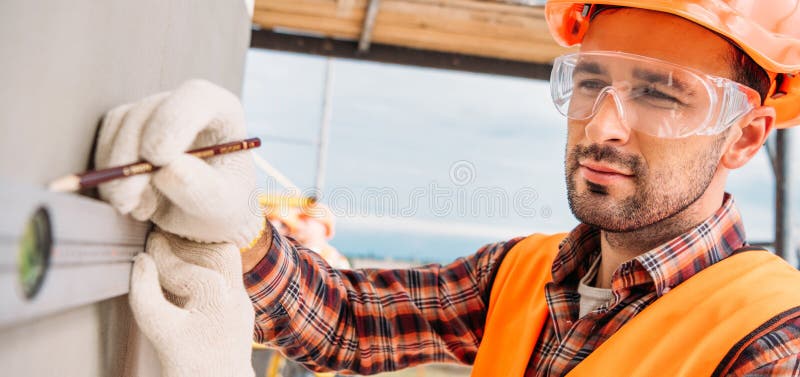 Wide Shot of Handsome Builder Using Bubble Level Stock Photo - Image of ...