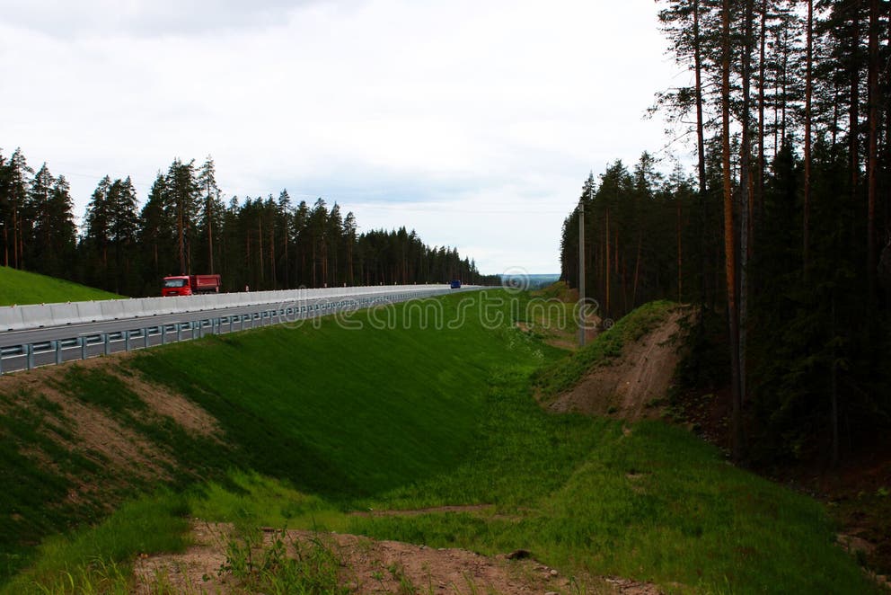 Wide and Sloping Roadside with Specially Planted Grass on the Main ...