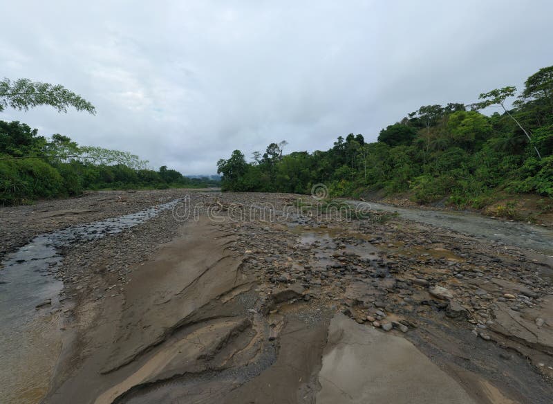 A Wide Stream in a Tropical Forest with Loads of Pebbles and Sand Stock ...
