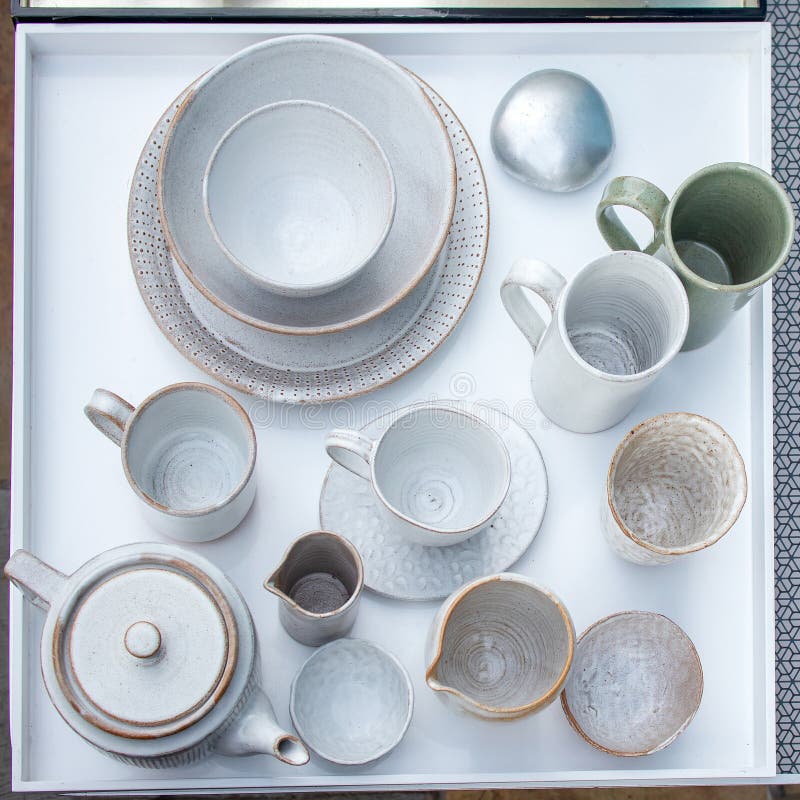 Wide Variety of White Plates Bowls and Mugs Lined Up. Top View Stock ...