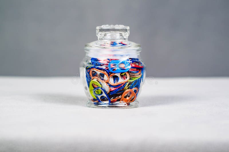 Wide View of a Jar of Multi Colored Can Pull Tabs Stock Image - Image ...