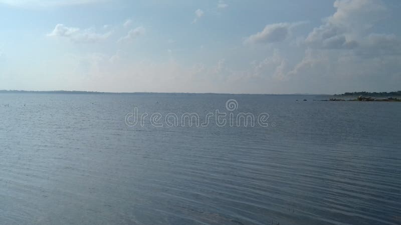 A Wide View of Water Side with Blue Sky Stock Image - Image of water ...