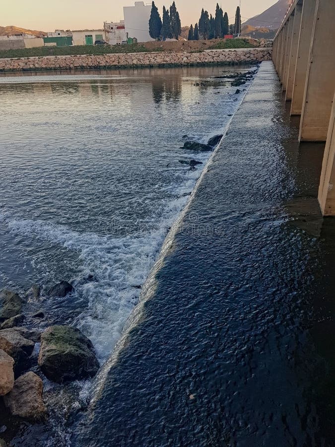 A Wide Waterfall Current Under a Bridge in Wadi. Close To Flowing Water ...