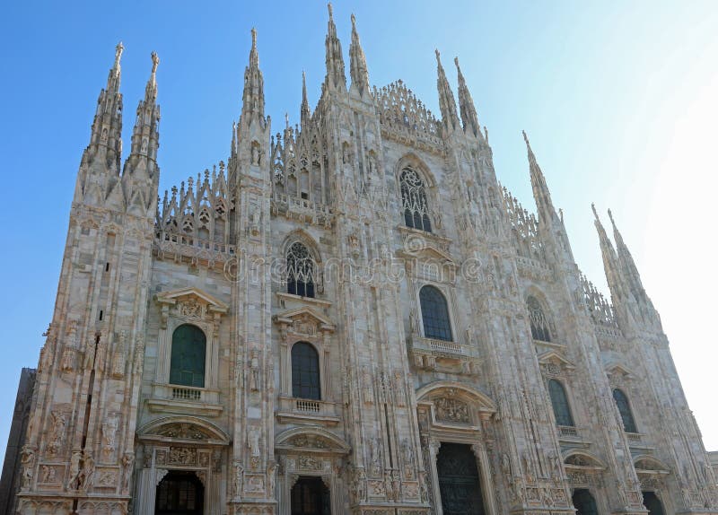 Wide Facade of the Milan Cathedral in Gothic Style with Tall Spires ...