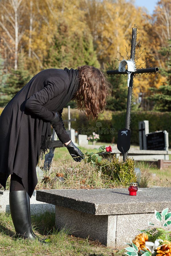 Widow at graveyard in fall stock photo. Image of mourn - 34799304