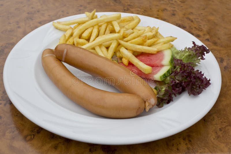 Wiener and French Fries on Plate Stock Photo - Image of wiener, chips ...