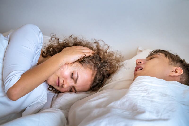 The Wife is Annoyed by Her Husband Snoring Stock Photo - Image of male ...