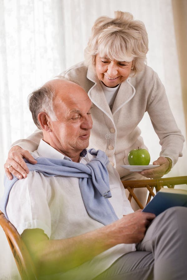 Wife Taking Care of Her Husband Stock Image - Image of loving, elegant ...
