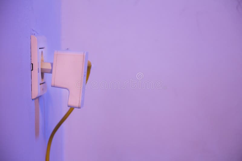 WiFi Extender in Electrical Socket on the Wall with Ethernet Cab Stock ...