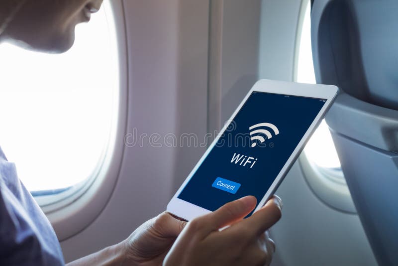 Wifi Internet Access in Airplane during Flight, Passenger Using Tablet ...