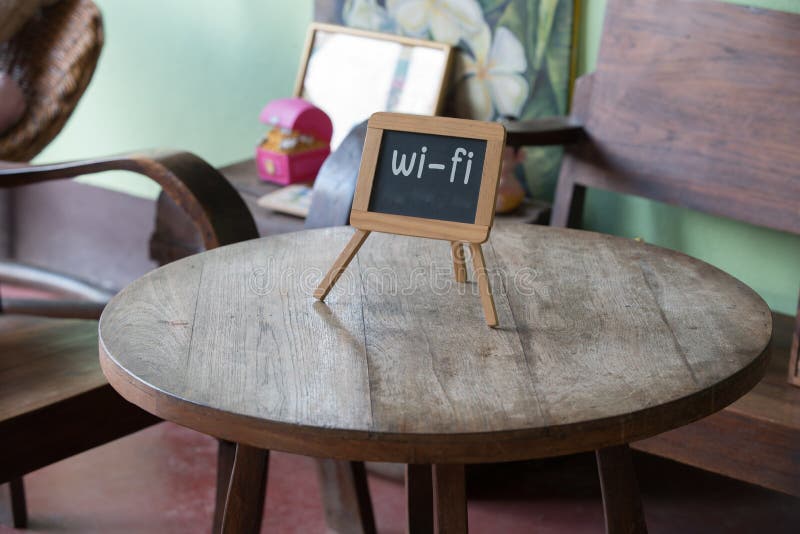 Wifi Sign on Wood Table in Public Cafe Stock Photo - Image of zone ...