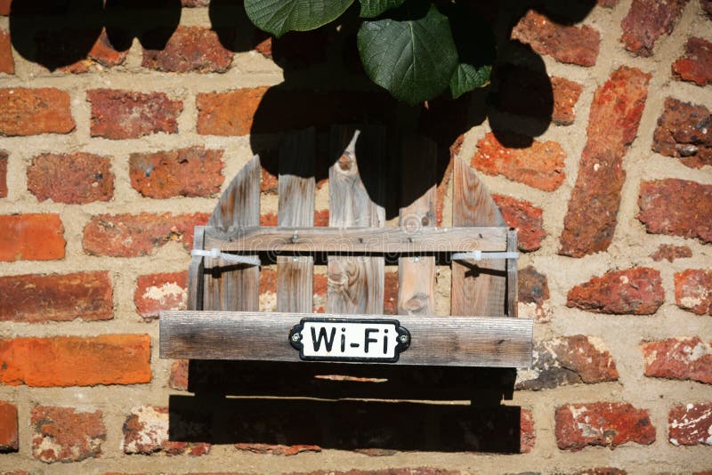 Wifi Sign at a Wooden Box on a Brick Wall Stock Photo - Image of ...
