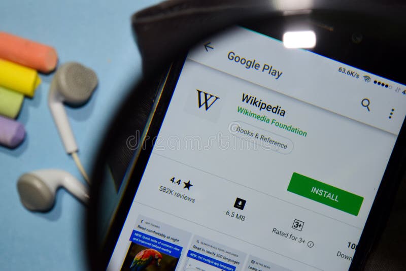 Wikipedia Dev App with Magnifying on Smartphone Screen. Editorial Photo ...