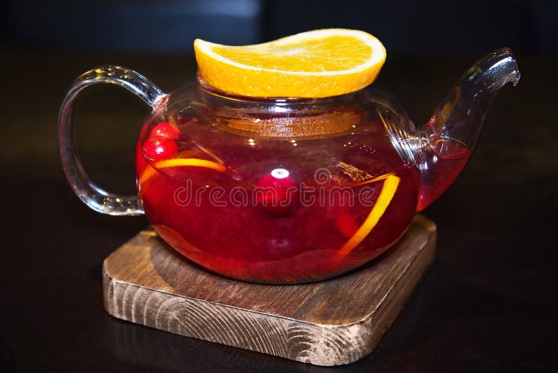 Wild Berry Tea with Fruit Slice Orange on a Wooden Stand Stock Photo ...