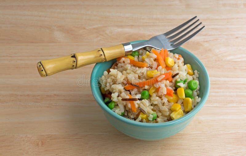 Wild and Brown Rice with Veggies in Bowl with Fork Stock Image - Image ...