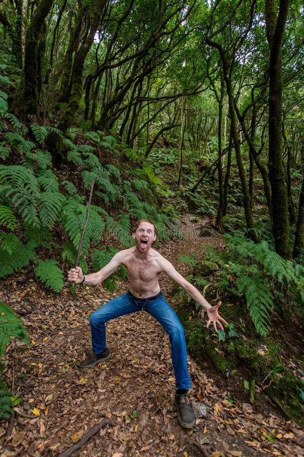 Wild man in the rainforest stock photo. Image of adventure - 173744742