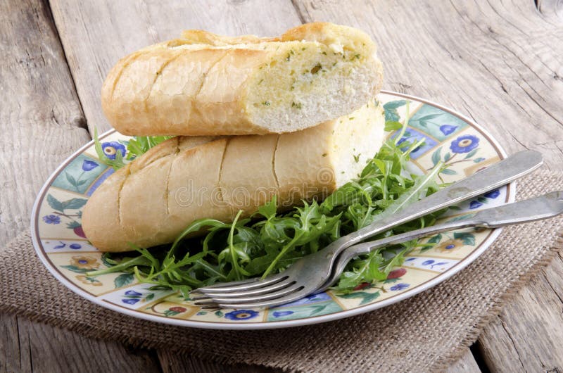 Wild Rocket Salad and Garlic Bread Stock Image - Image of bread, food ...