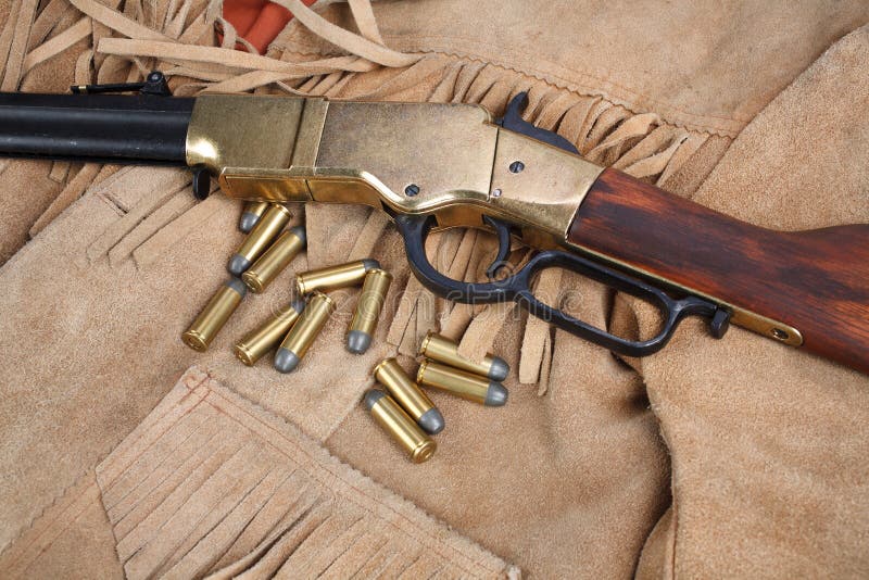 Wild West Repeating Rifle with Ammunition and Sheriff Badge Stock Photo ...
