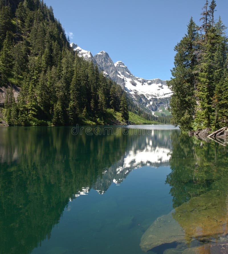 Wilderness alpine lake stock image. Image of water, snow - 17010401