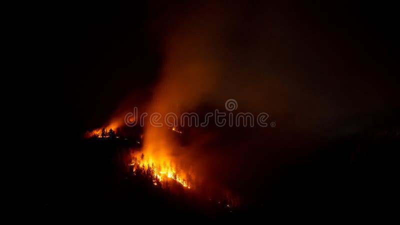 Wildfire Smoldering on the Mountain Range Stock Photo - Image of ...