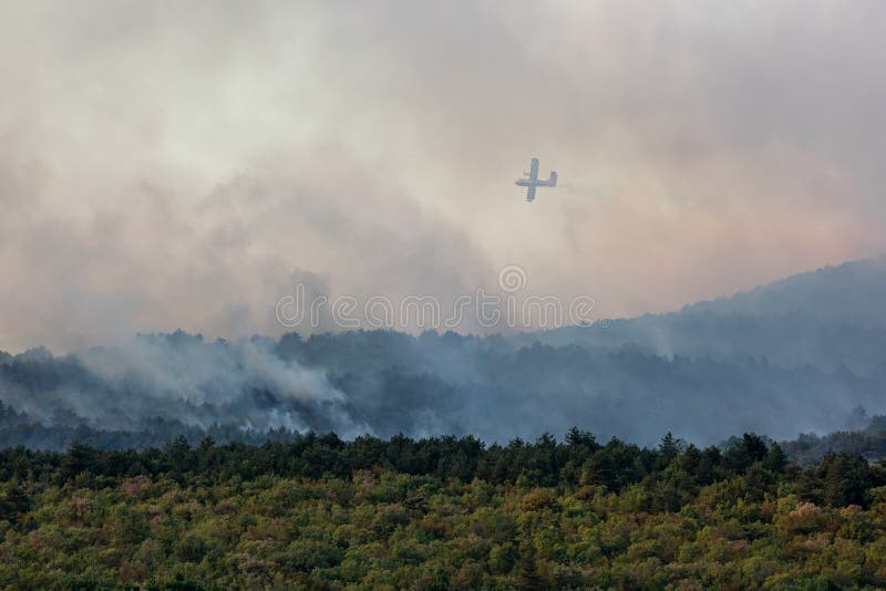 Wildfire with Strong Wind and Drought, Help from Canadair Stock Photo ...