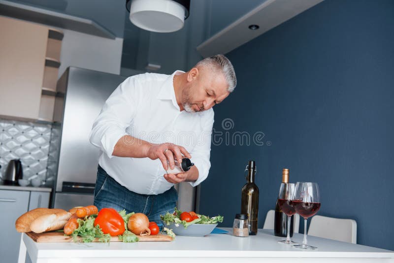 It Will Be Delicious. Man in White Shirt Preparing Food on the Kitchen ...