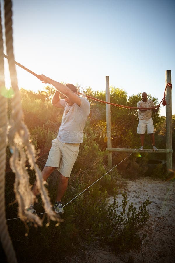 Will he Make it. Men Walking Across an Obstacle at Bootcamp. Stock ...