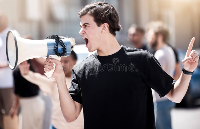 We Will Not Be Silenced. Shot of a Young Man Yelling through a ...