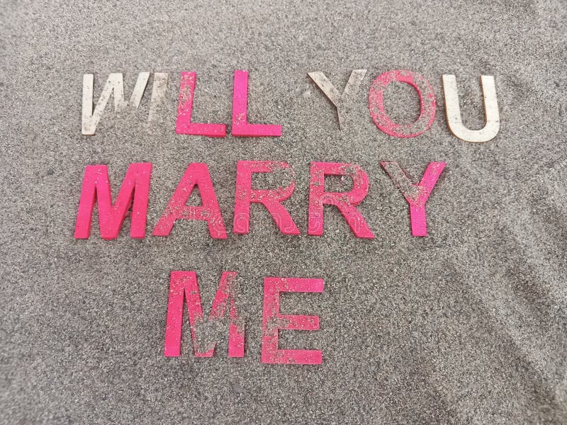 Will You Marry Me Written on Sand and Partially Covered by Sand Stock ...